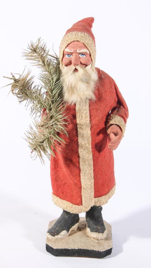 A German Father Christmas Figure With Feather Tree
