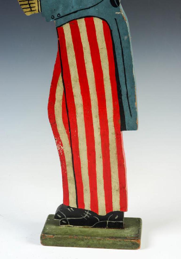 AN EARLY 20TH C. FOLK ART UNCLE SAM FLAG HOLDER