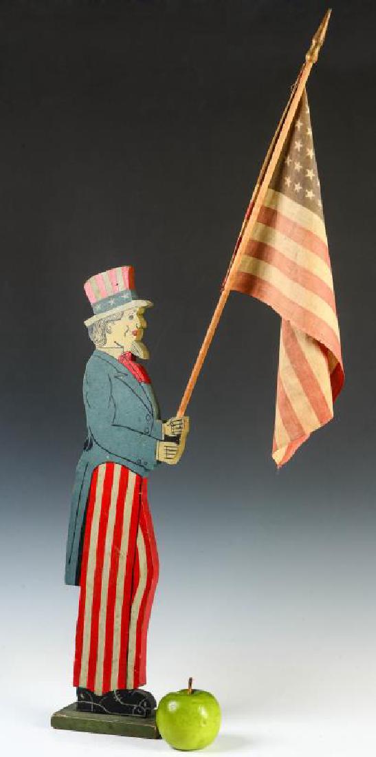 AN EARLY 20TH C. FOLK ART UNCLE SAM FLAG HOLDER
