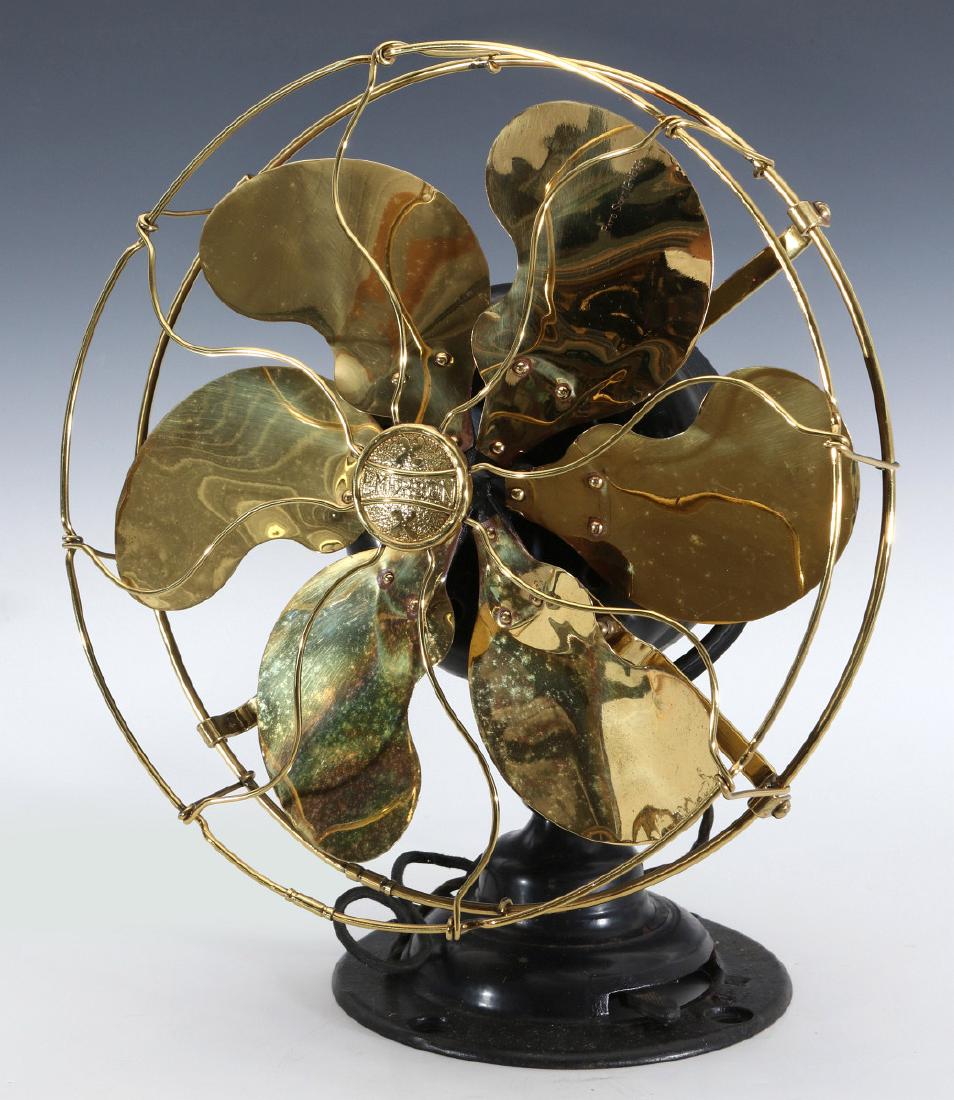 AN EMERSON ELECTRIC TABLE FAN WITH YOKE CIRCA 1914