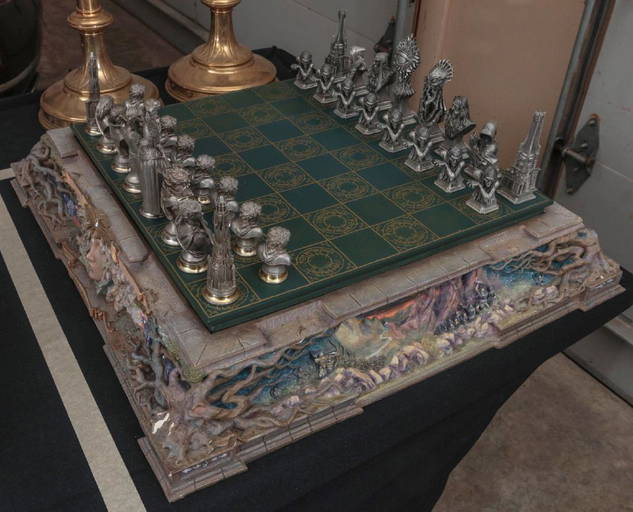 A Lord Of The Rings Chess Set And Board