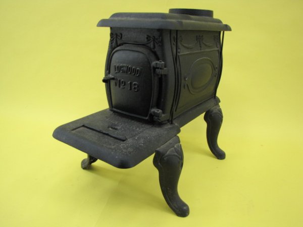 A CUTE SMALL ANTIQUE IRON STOVE BY HARDWICK STOVE CO