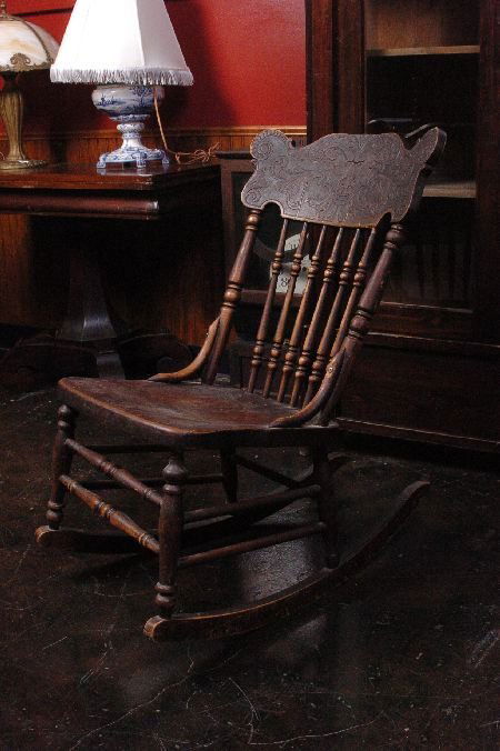 ANTIQUE OAK PRESSED BACK ROCKING CHAIR WITH NORTH WIND