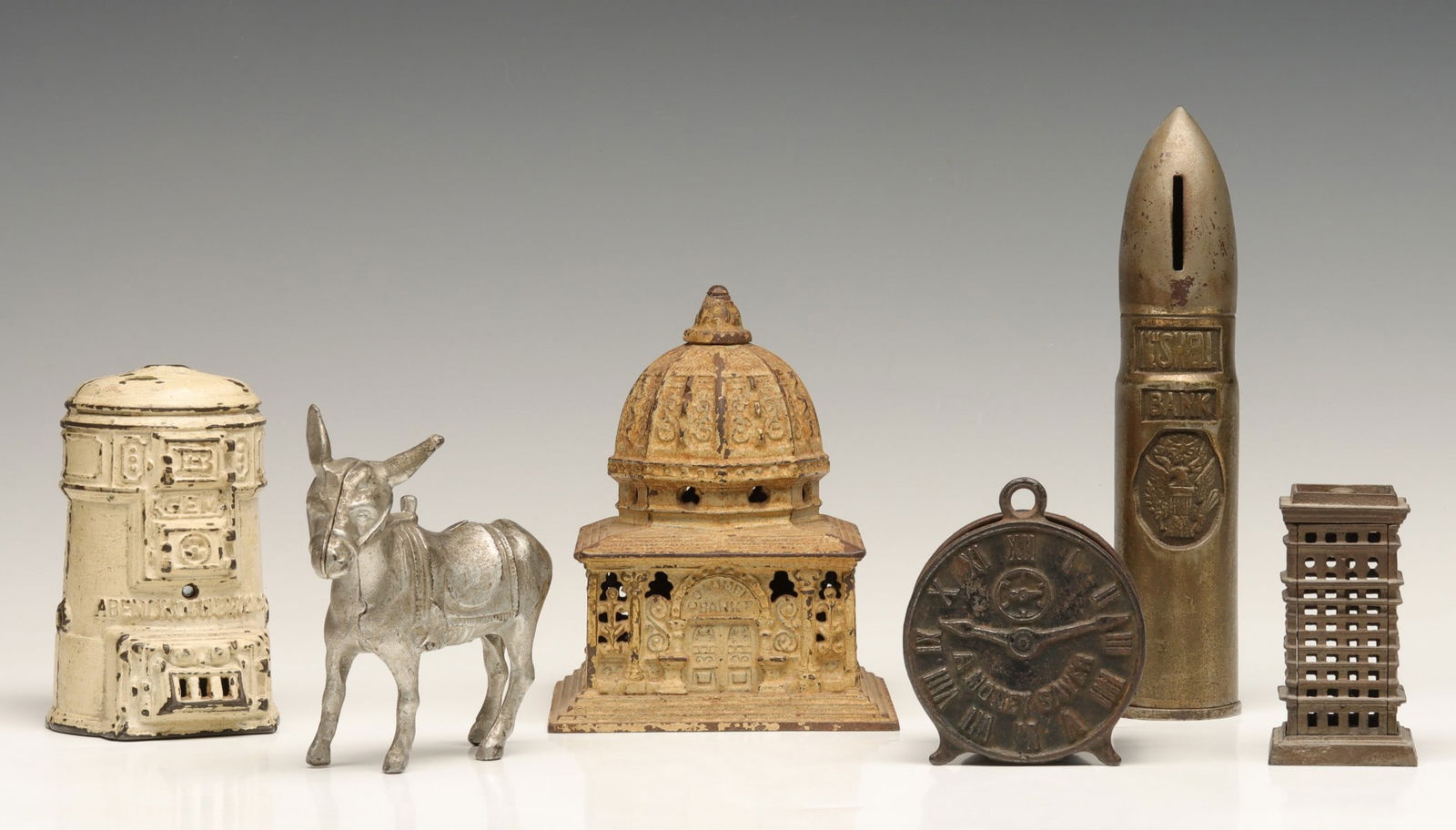 Six Antique Cast Iron Banks Including Artillery Shell Auction