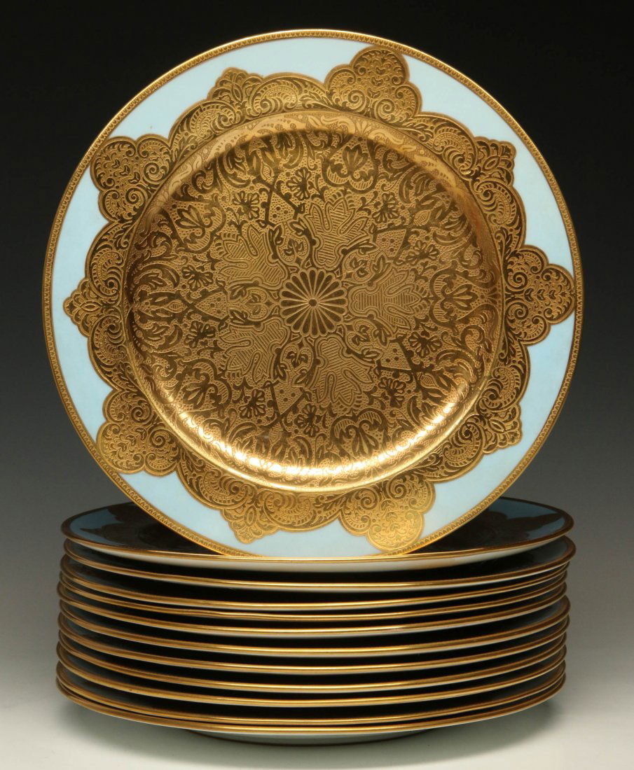TWELVE HEAVY GOLD EMBOSSED PORCELAIN SERVICE PLATES