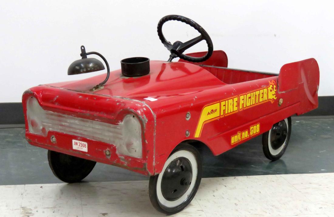 VINTAGE AMF STEEL FIRE FIGHTER PEDAL CAR. LENGTH 42"