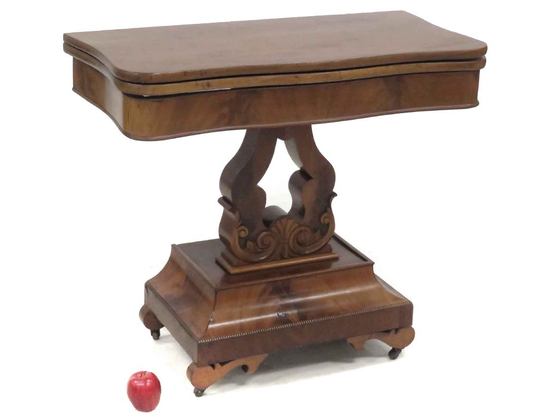 EMPIRE MAHOGANY LYRE BASE GAME TABLE, 19TH CENTURY.