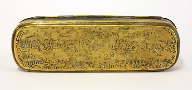 An embossed brass tobacco box, 18th century, the top : Lot 110
