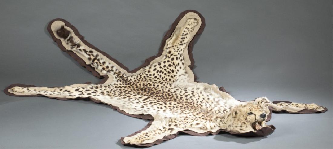 Cheetah skin rug. - Sep 15, 2018 | Quinn's Auction Galleries in VA