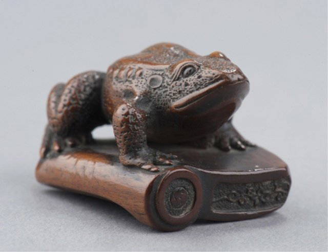 A Wood Netsuke Of Toad.