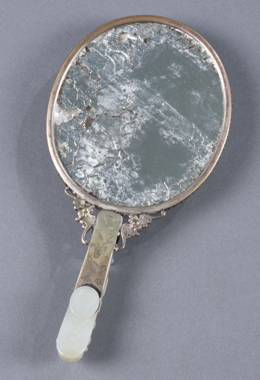 A Chinese jade medallion hand mirror. : Lot 380