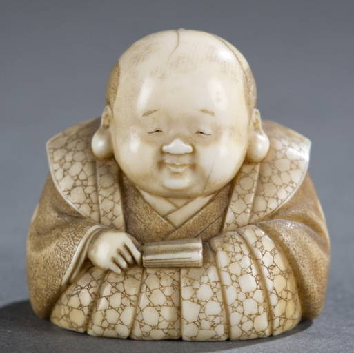Ivory Netsuke Of A Seated Male.
