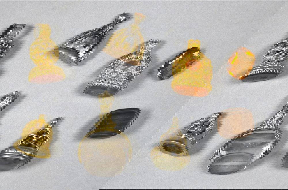 Group Six Assorted Fob Seals With Gold-plated Mounts, And Two Unmounted ...