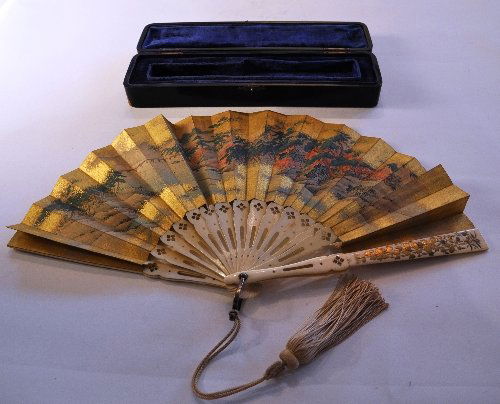 A Meji period Japanese ivory fan with gold figural deta