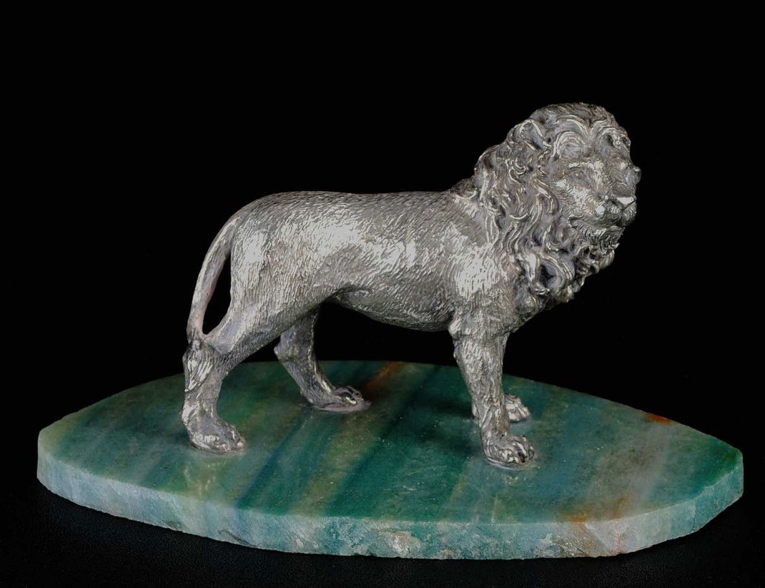 Silver Clad Figure Of A Lion