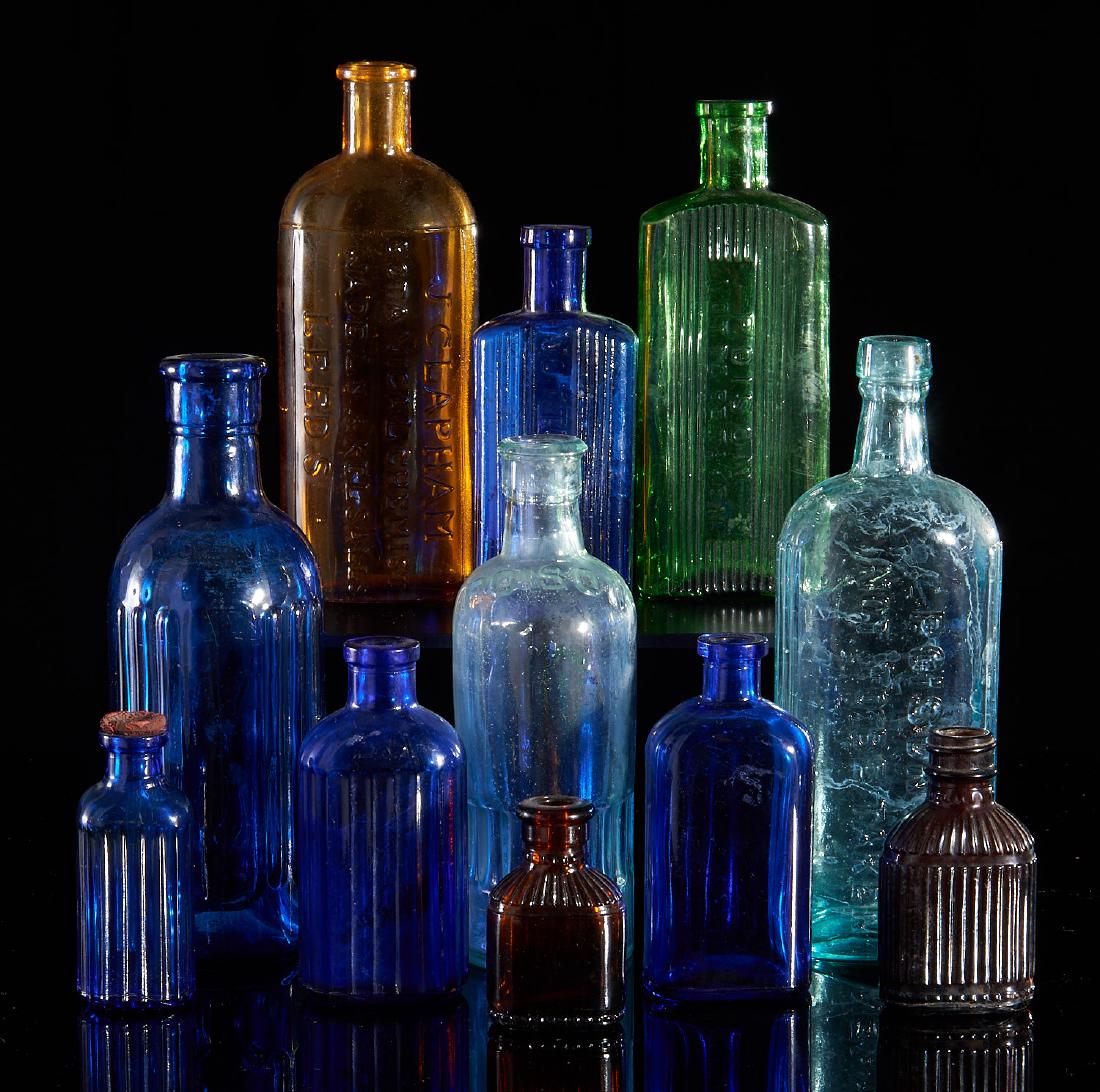 (11) assorted antique poison and tonic bottles