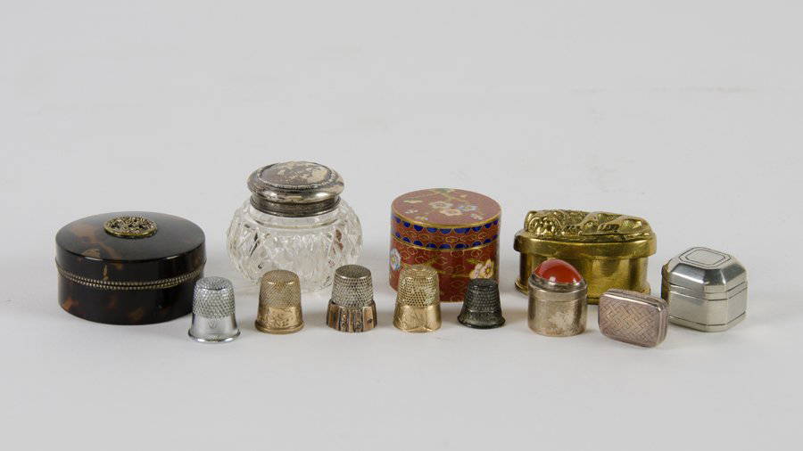 A Collection Of Various Boxes And Thimbles