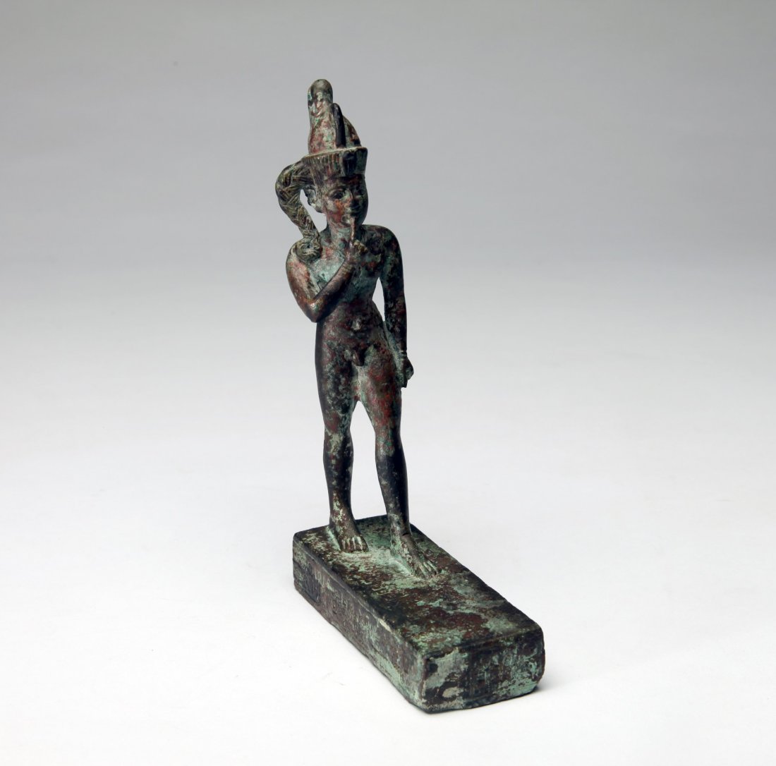 An Egyptian Bronze Figure of Striding Harpocrates