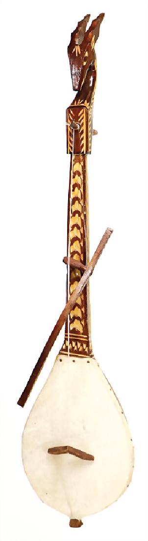 gusle with bow, Yugoslavia, carved and painted wood,