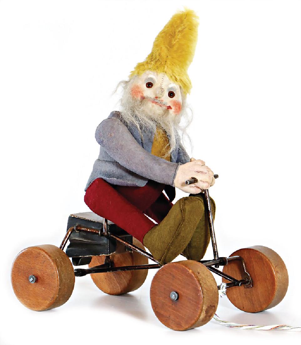 STEIFF dwarf, Record-Puck, on a self propelling vehicle