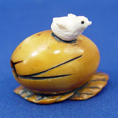1048: CARVED IVORY EGG AND BIRD NETSUKE signed