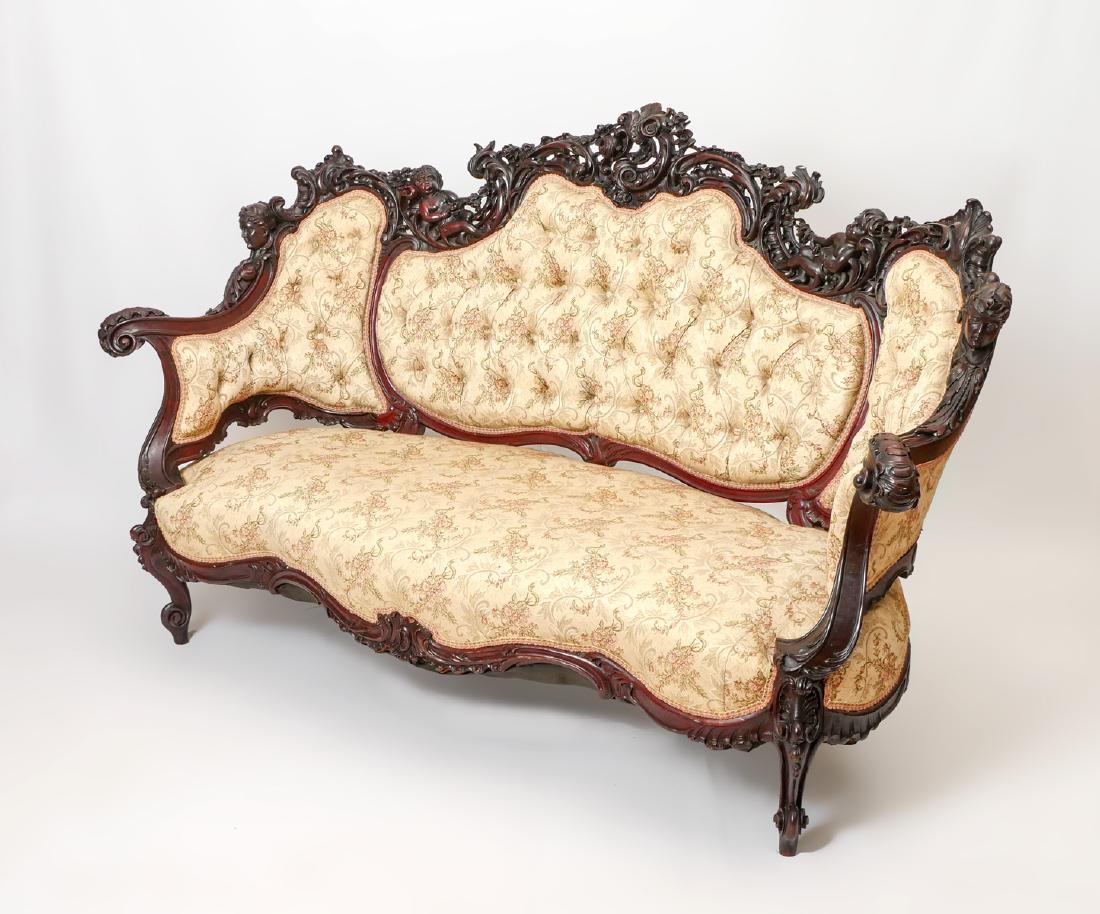 HIGHLY CARVED VICTORIAN SOFA