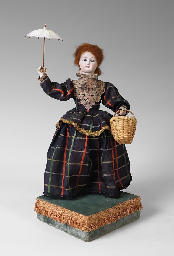 5: WIND UP MUSICAL AUTOMATON DOLL AND GLASS DOME