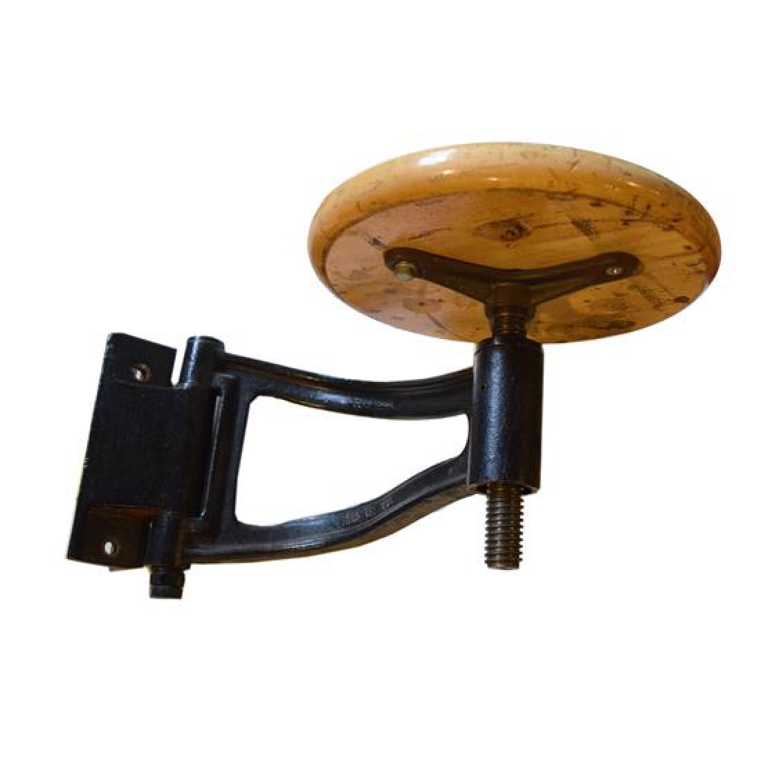 An Iron And Wood Swing Arm Stool 19.5" W X 10 " D X 12"