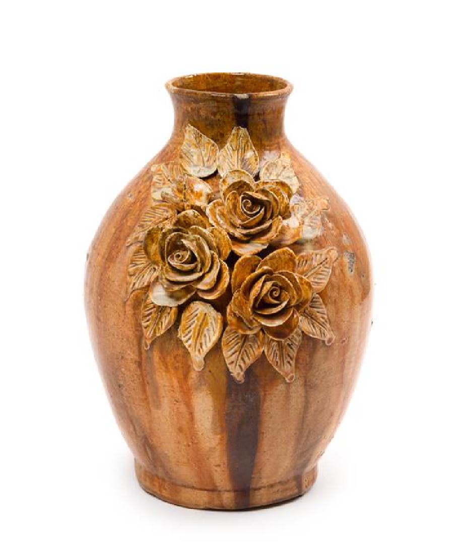 A Glazed Pottery Vase With Applied Flowers Height 10