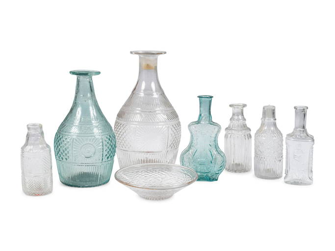 Eight Early American Pattern Molded Glass Bottles And Flasks
