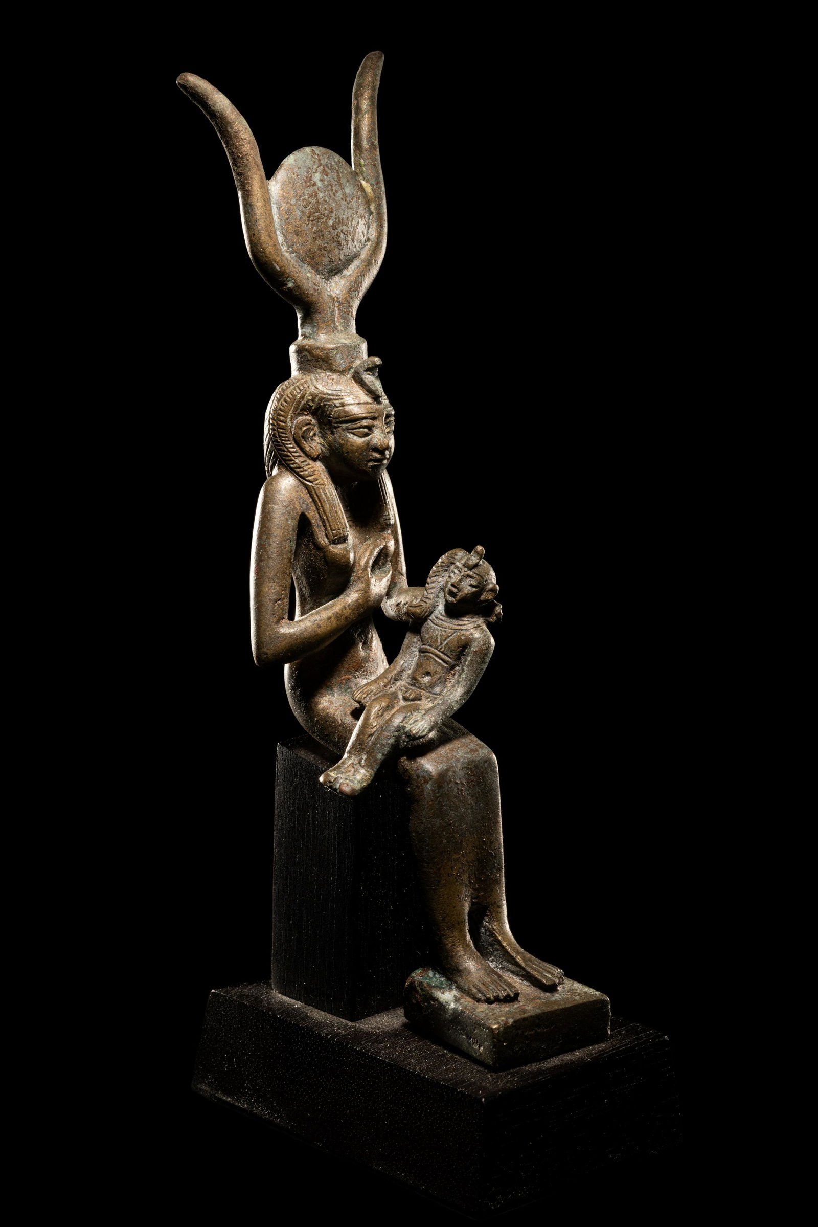 An Egyptian Bronze Isis And Horus Height 6 1/4 Inches (16 Cm).