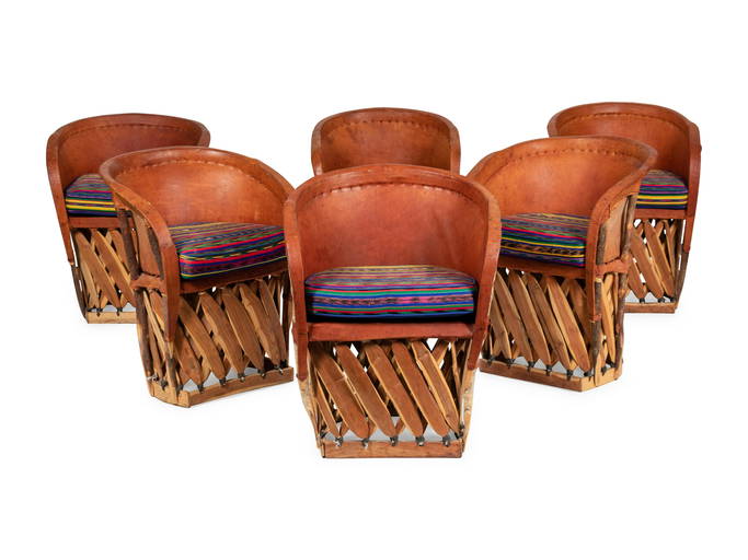 A Mexican Equipale Dining Table And Chairs