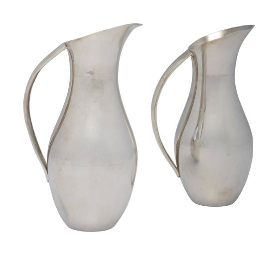 A Pair Of Mexican Silver Pitchers