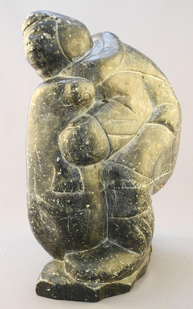 Inuit Stone Carving: Figure Handling Seal By Ann