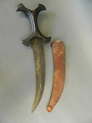 An Eastern Curved Dagger With Carved Crucifix Handle