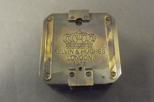 A brass Kelvin & Hughes compass marked London 1917, 2¾'