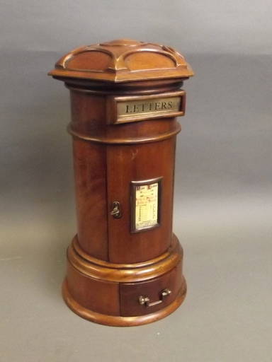 A Circular Mahogany Table Post Box With A Hexagonal
