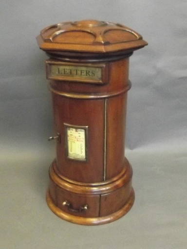 A Circular Mahogany Table Post Box With Carved Pagoda
