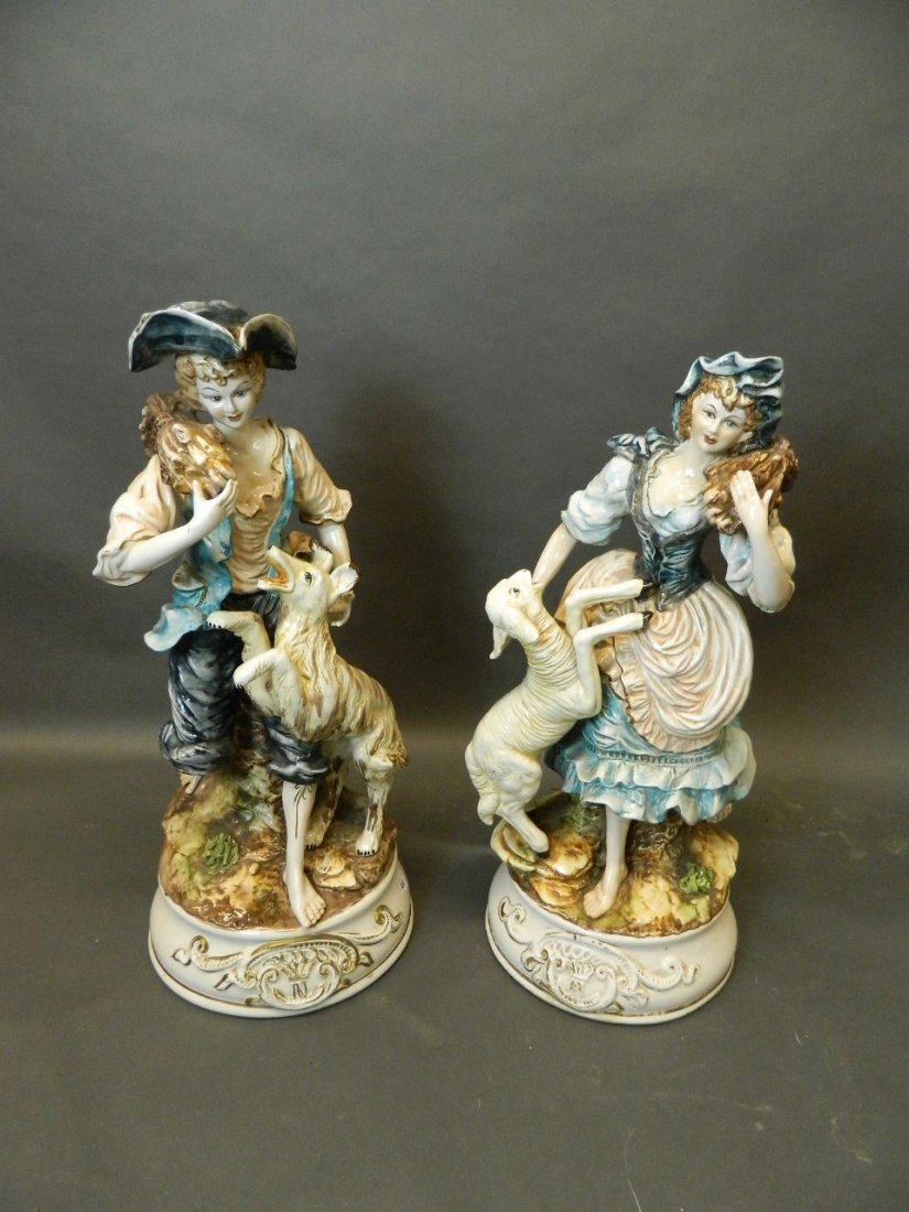 A large pair of Capo di Monte figures of a shepherd and