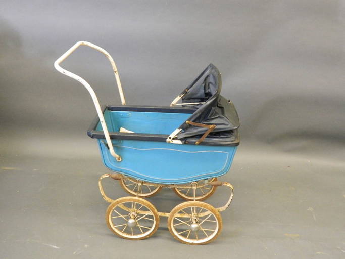 A Triang Toy Pram With Spring Chassis And Folding