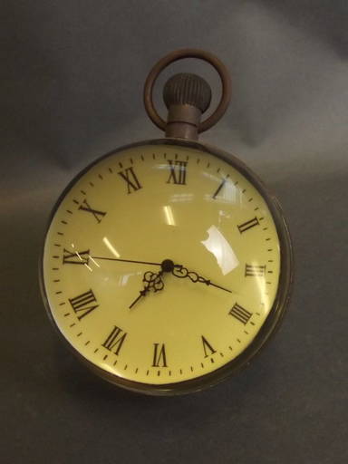 A Brass Bound Glass Ball Desk Clock With Exposed