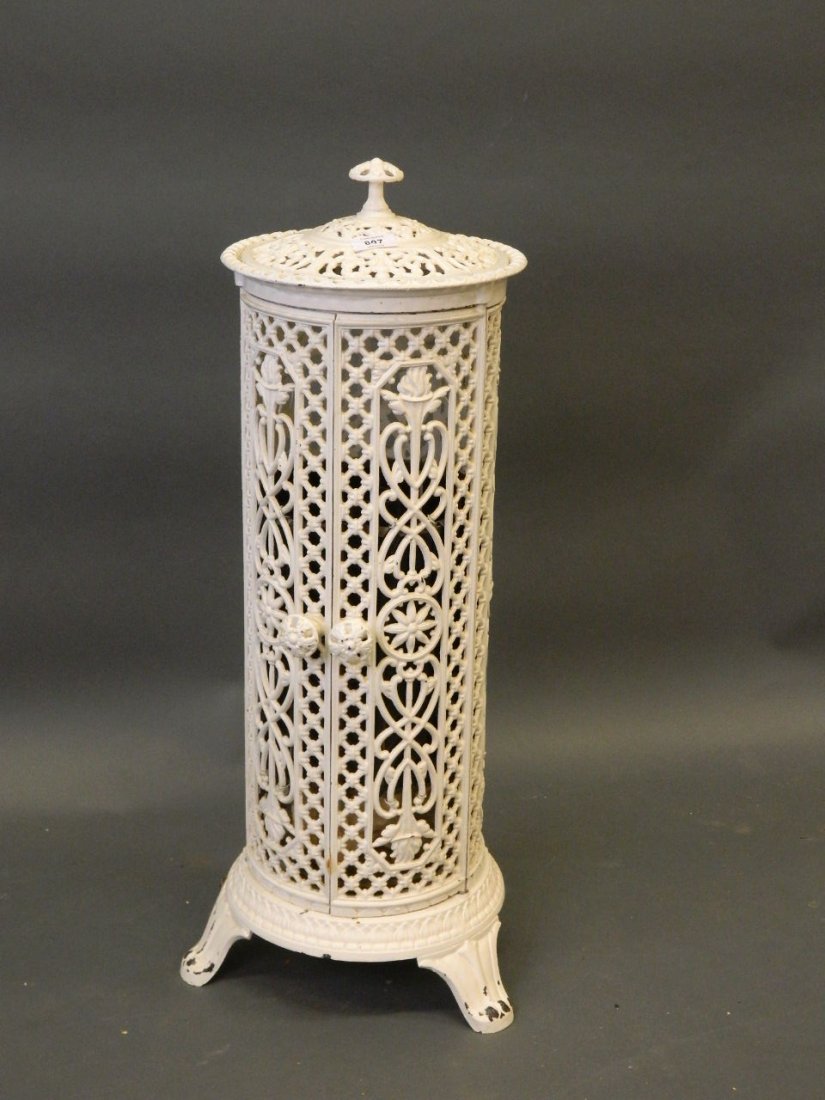 A C19th French cast iron paraffin heater, the tubular