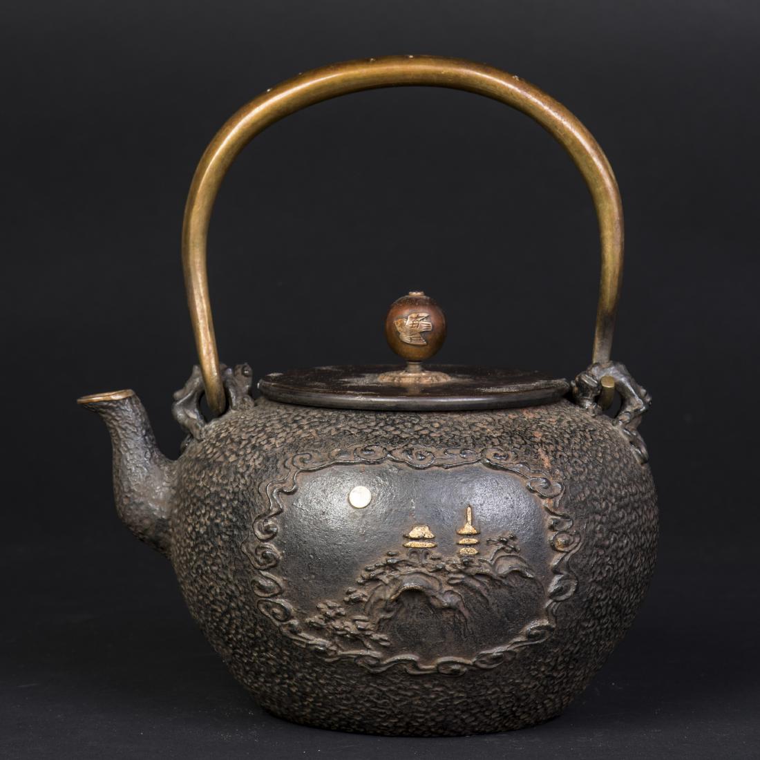 A JAPANESE TETSUBIN CAST IRON TEAPOT