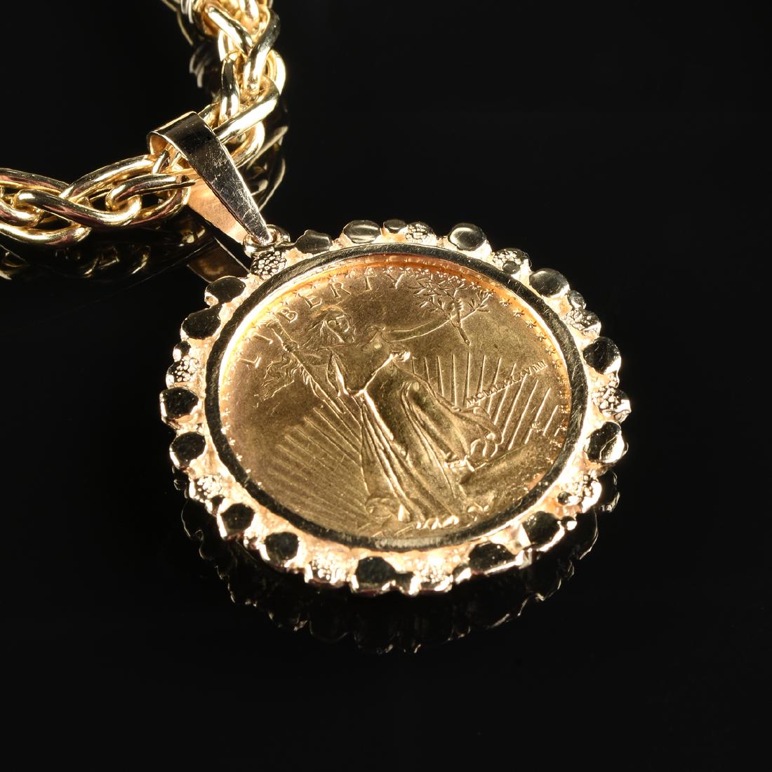 A 14K YELLOW GOLD COIN FRAME WITH U.S. 1 OUNCE LIBERTY