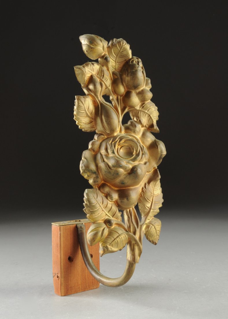 A SET OF EIGHT VICTORIAN GILT PRESSED METAL DRAPERY