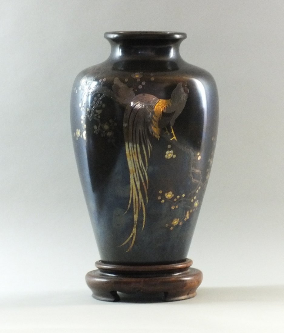 A Japanese bronze Shakudo vase, Meiji period, last