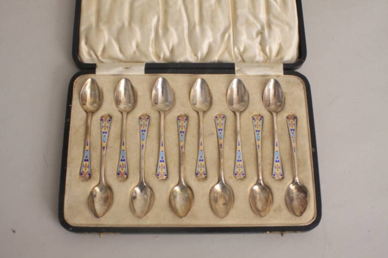 An Art Deco Set Of Twelve Silver And Enamel Tea Spoons,