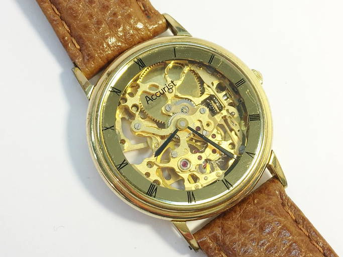 A Gent's Gold Plated Accurist Wind Up Skeleton Watch,