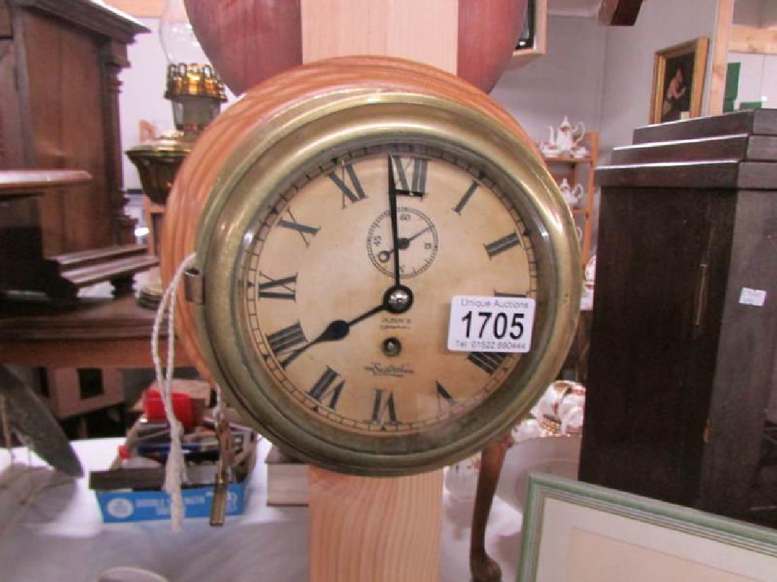 A Sestrel Brass Ship's Clock With Name To Face: