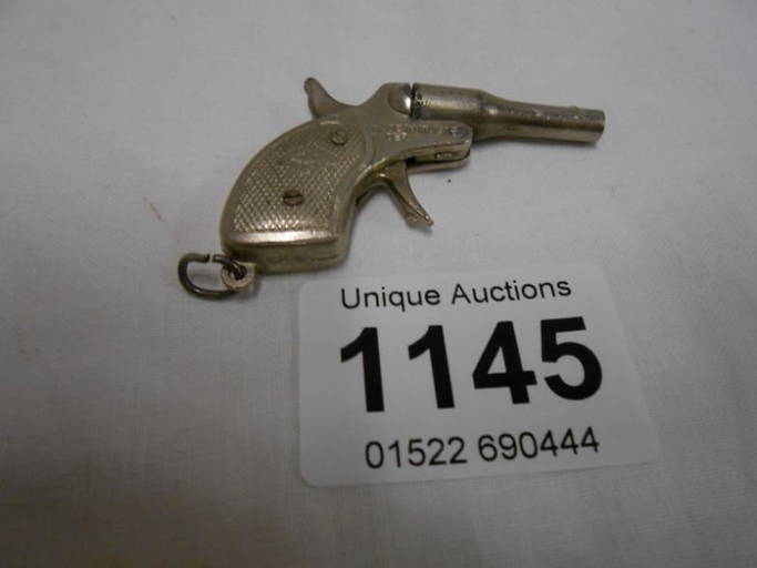 A Miniature Cap Gun Watch Fob Marked Molgora Mignonnett